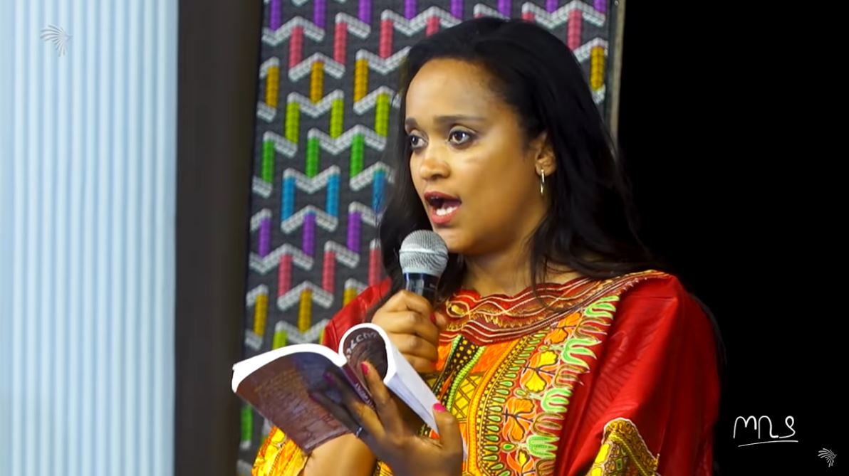 Haregeweyn Asefa reading Alex Abram’s book